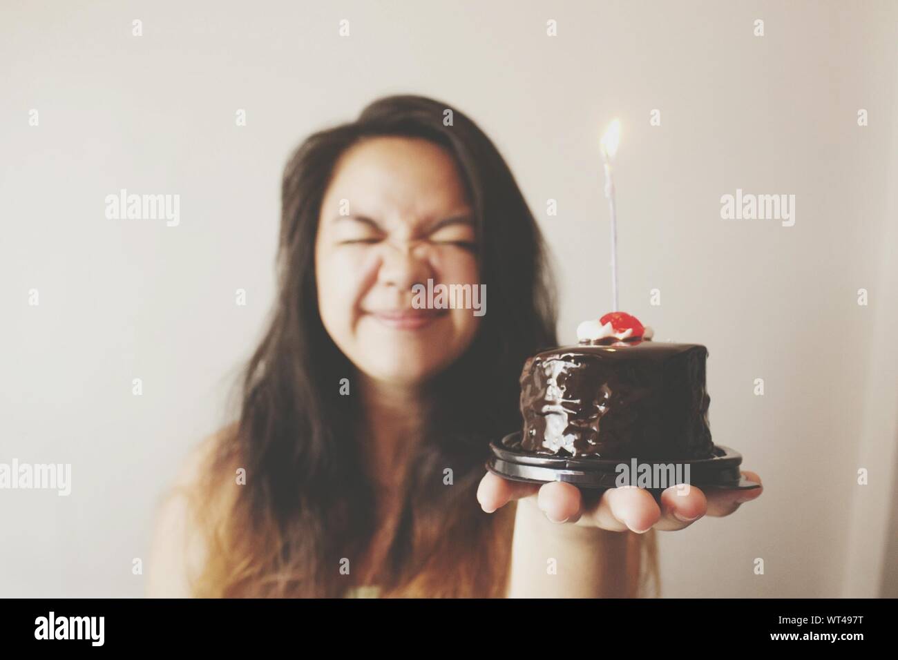 Indian woman eating cake hi-res stock photography and images - Alamy