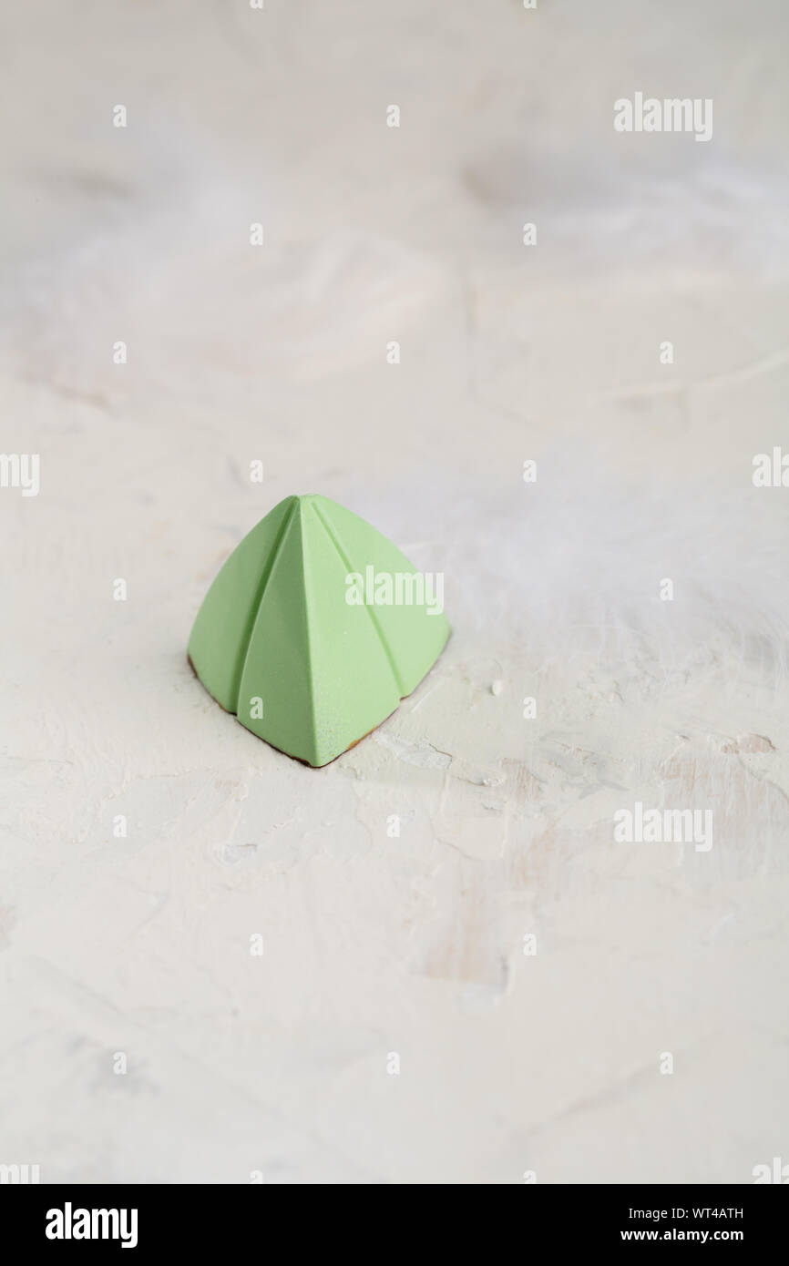 Modern chocolate candy close-up on white Stock Photo - Alamy