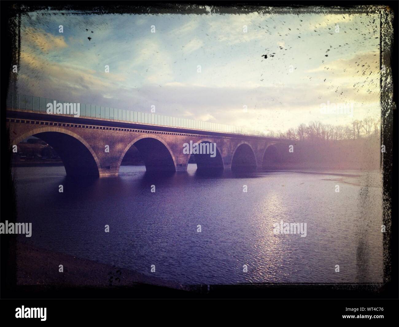 Arched Bridge Over Calm Lake Stock Photo - Alamy