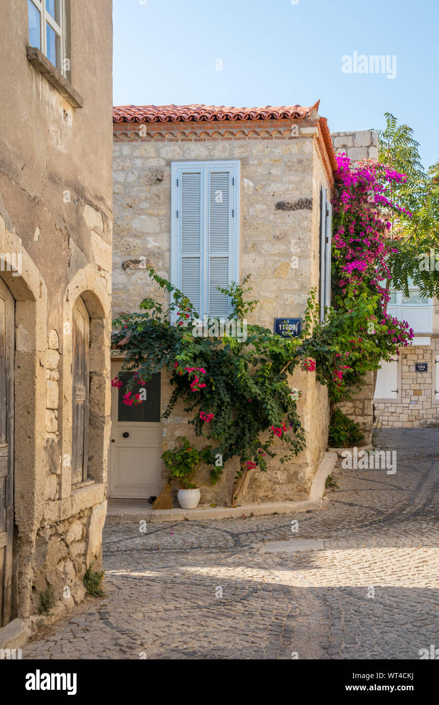 Alacati, Turkey - September 3rd 2019: Cobbled street and old stone ...