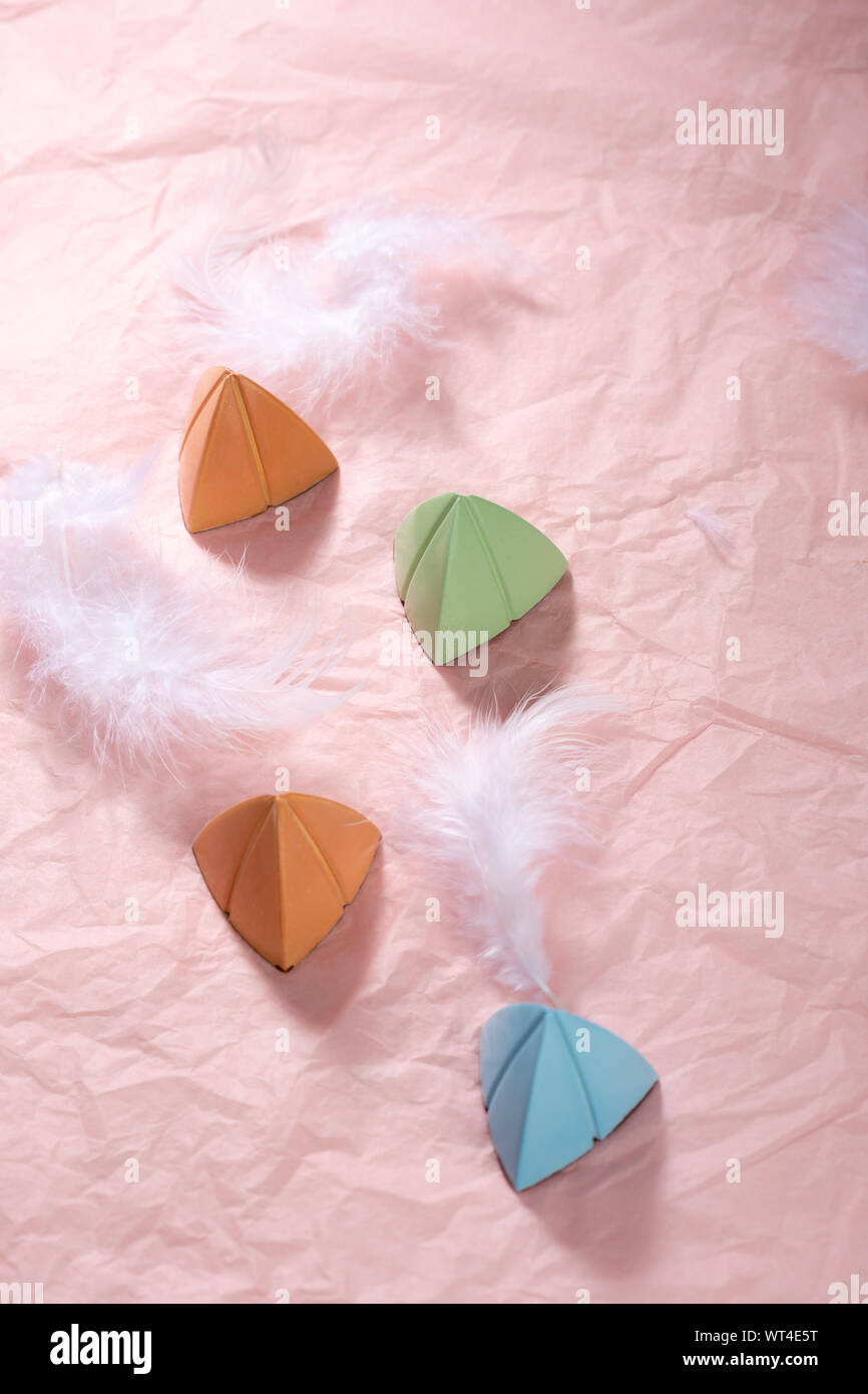 Modern chocolate candy set on pink background Stock Photo - Alamy