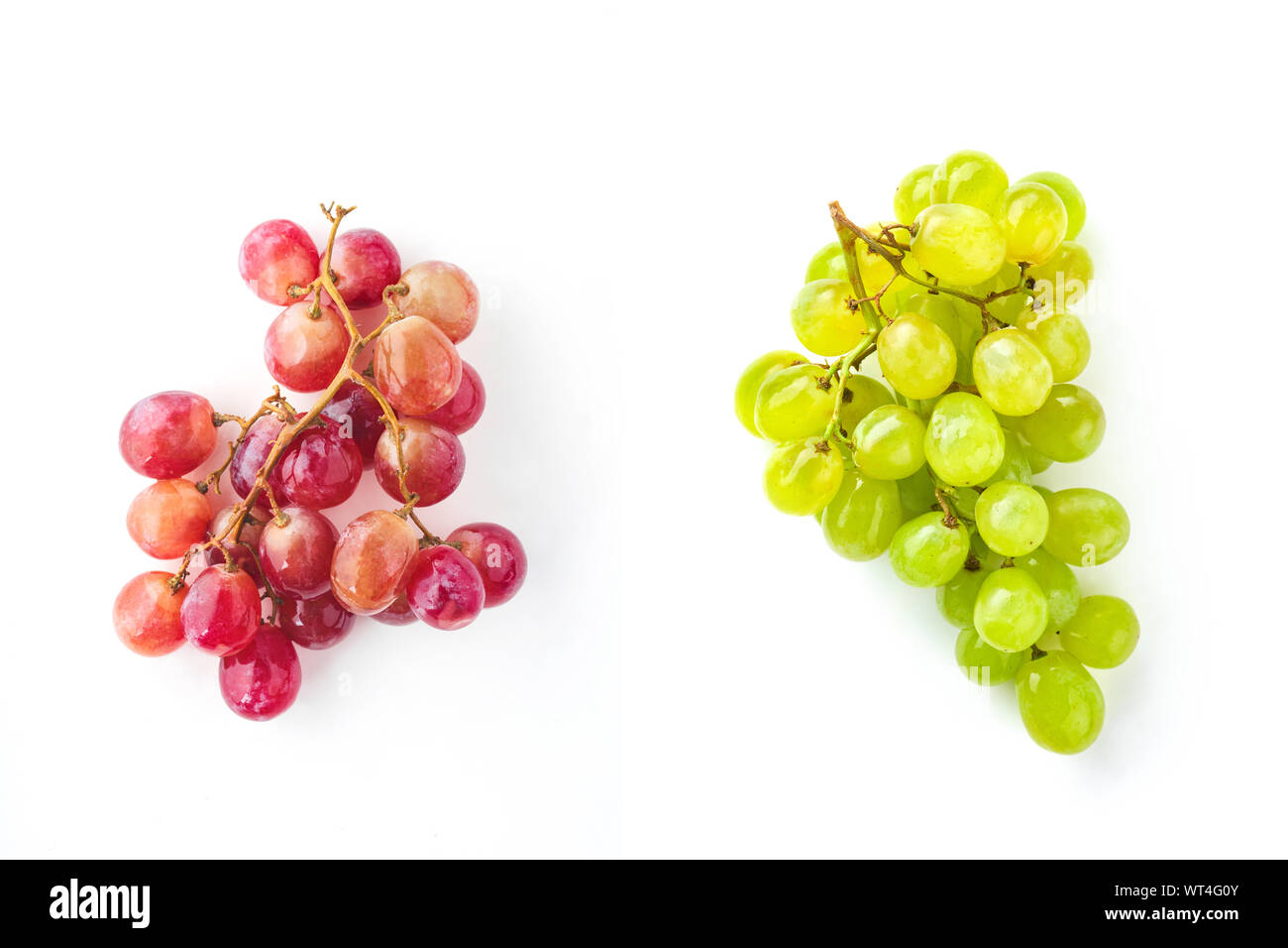 A bunch of red grapes with a bunch of white grapes. Top view, flat lay ...