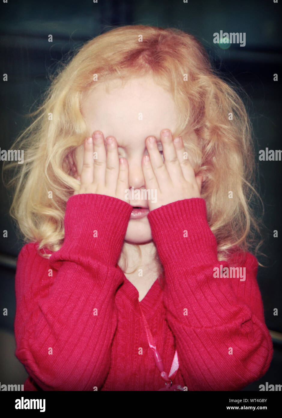 Girl hiding face hands hi-res stock photography and images - Alamy