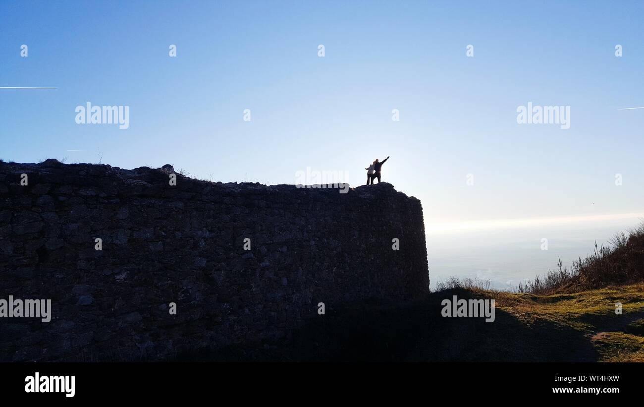 Two people standing on cliff hi-res stock photography and images - Alamy