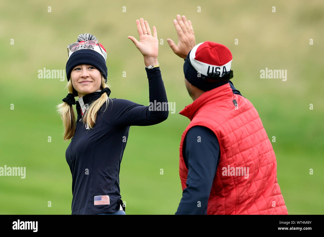 Team USA's Nelly Korda high fives her caddie Jason McDede after making ...