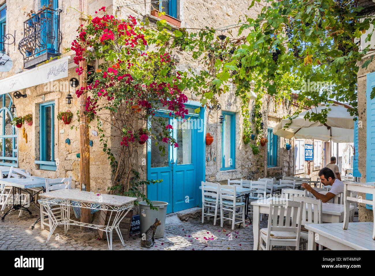 Alacati, Turkey - September 4th 2019: Man sat at table outside a ...