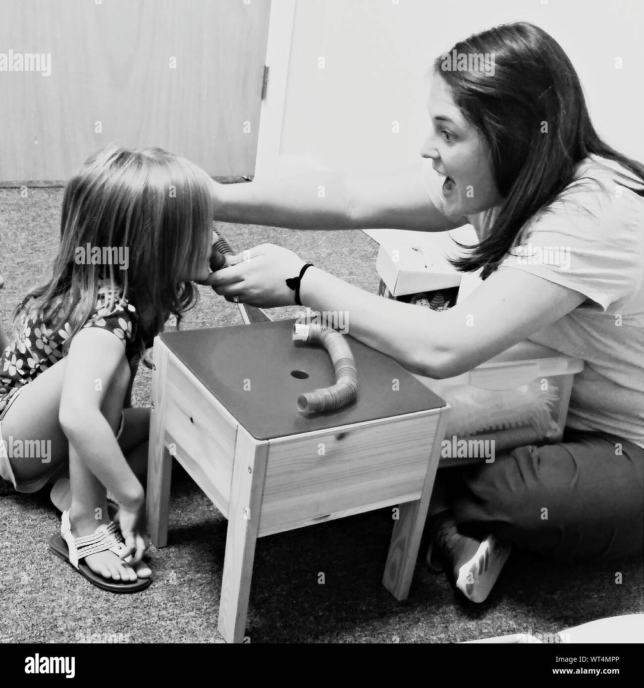 mother-teaching-daughter-speech-therapy-at-home-stock-photo-alamy