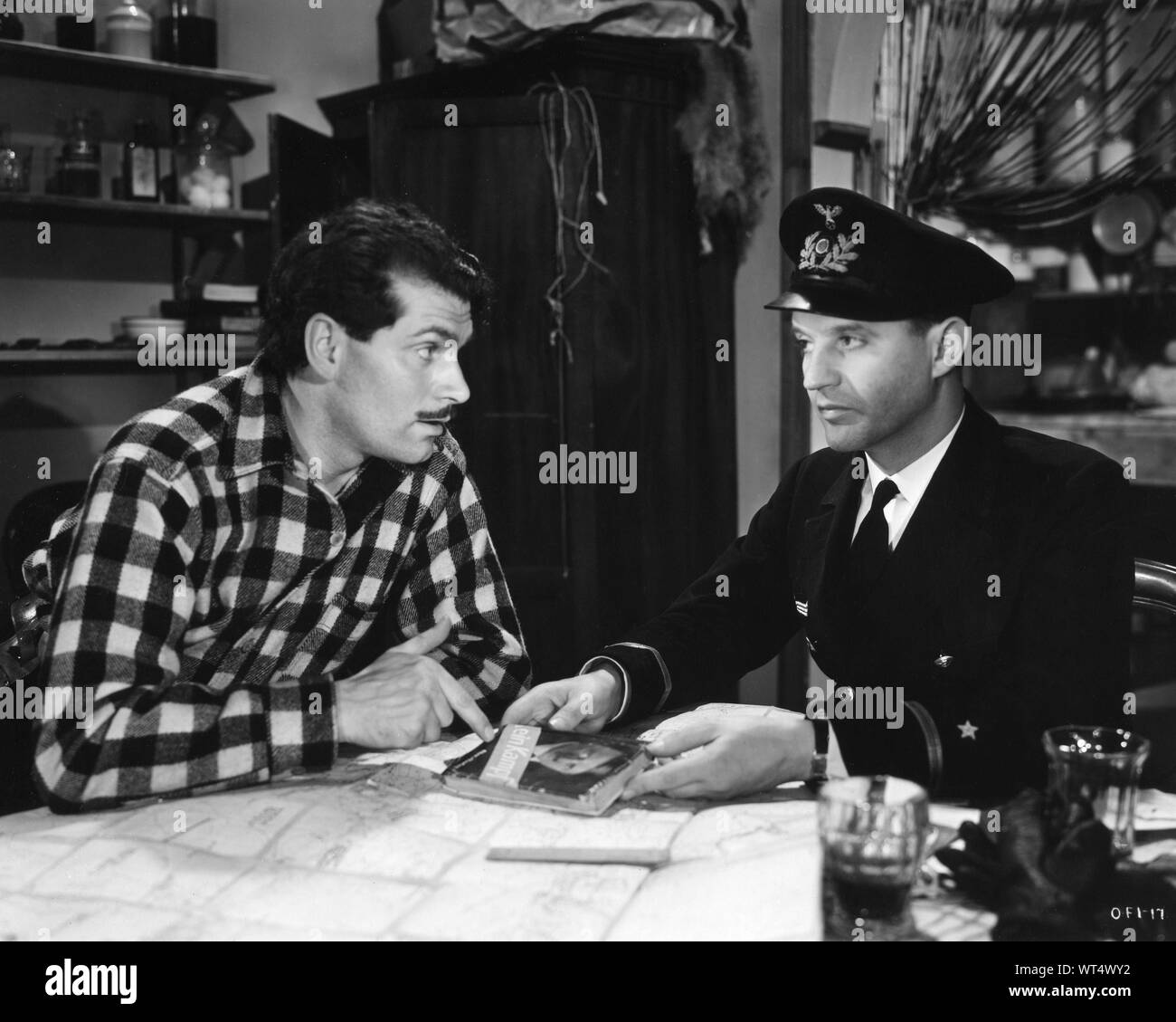 LAURENCE OLIVIER as Johnnie the Trapper and ERIC PORTMAN as Lieutenant ...