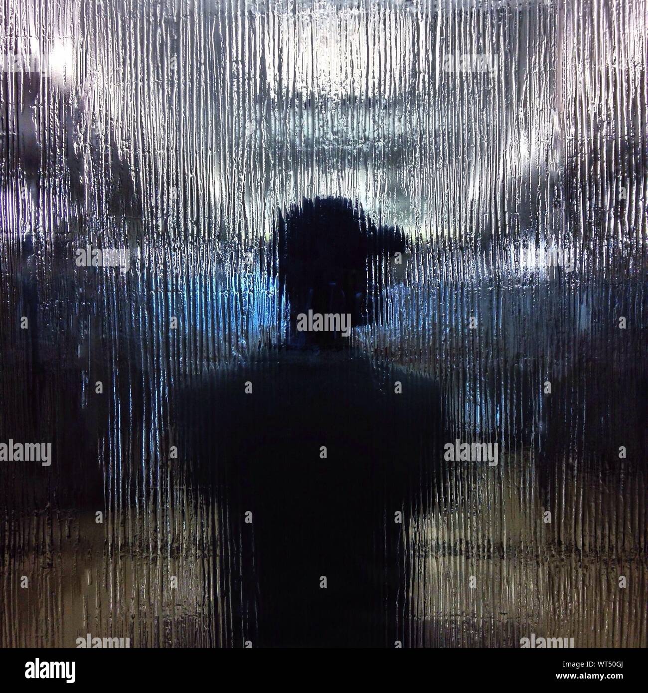 Silhouette behind glass hi-res stock photography and images - Alamy