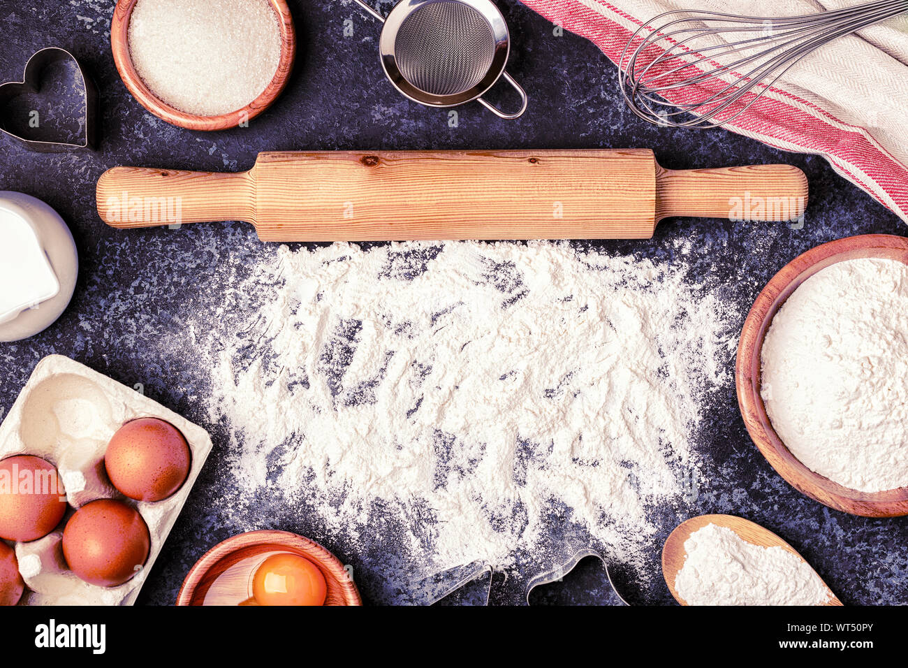 Ingredients for baking - flour, wooden spoon, rolling pin, eggs. Top ...