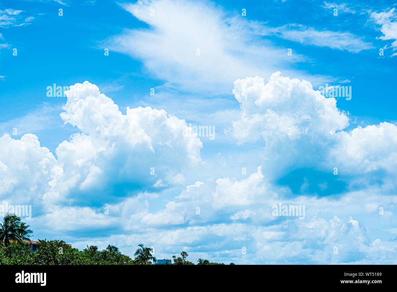 White clouds in blue sky, abstract blurred background Stock Photo - Alamy