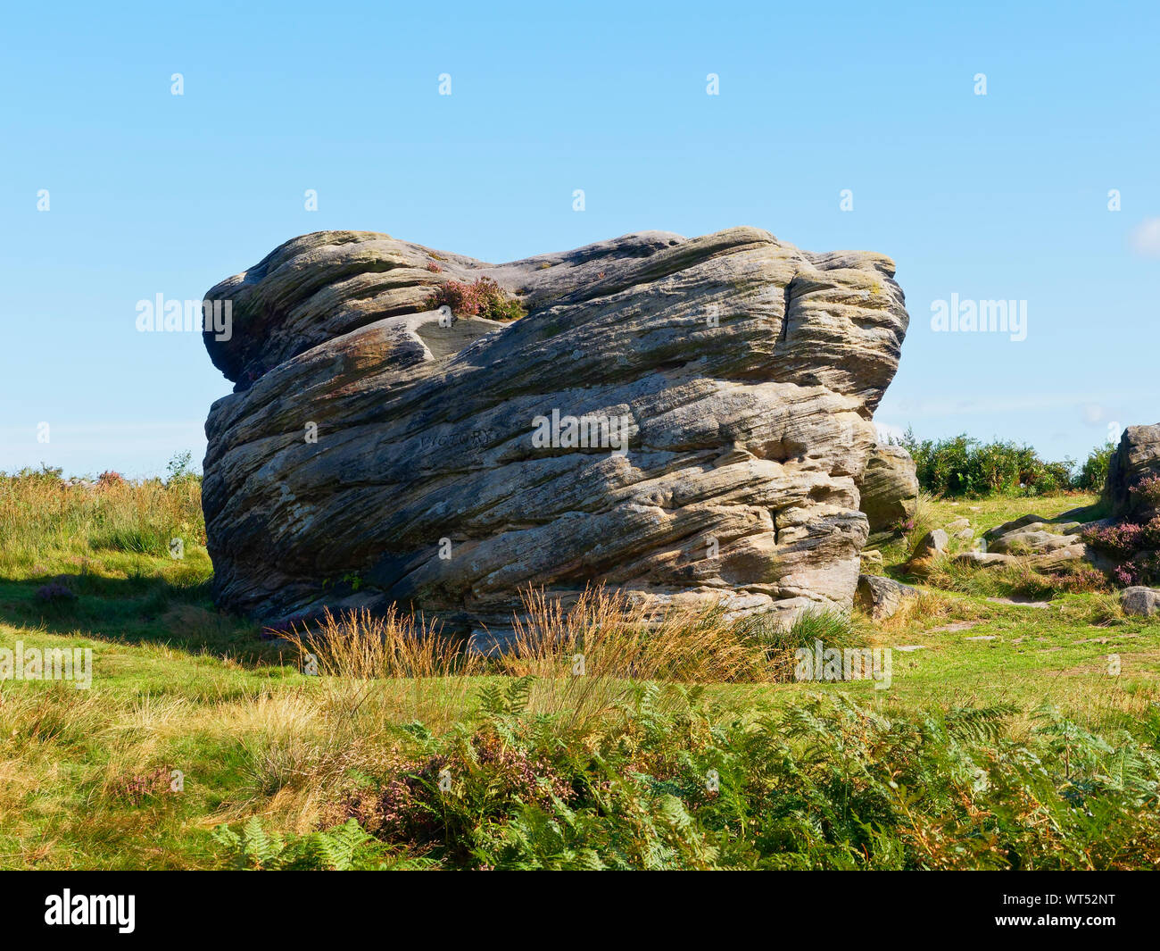 Worn and weathered gritstone rock formation named Victory after Lord ...