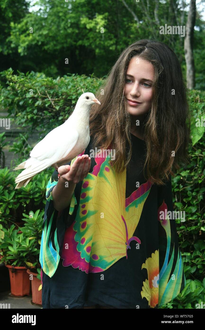 Woman and bird hi-res stock photography and images - Alamy