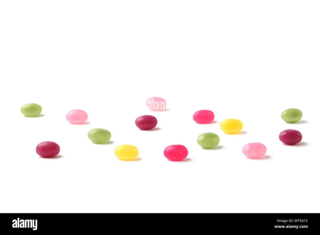 colorful candies jelly beans spread isolated on white background Stock ...