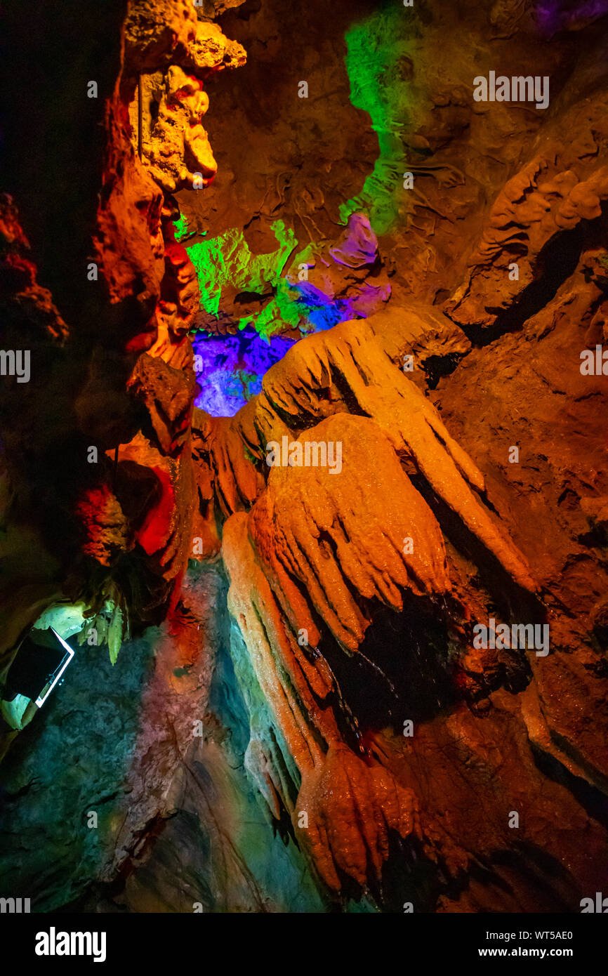 Beautiful illuminated multicolored stalactites in Danzhou Stone Flower ...
