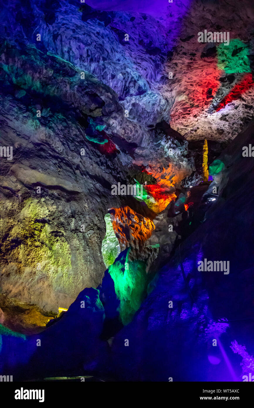 Beautiful illuminated multicolored stalactites in Danzhou Stone Flower ...