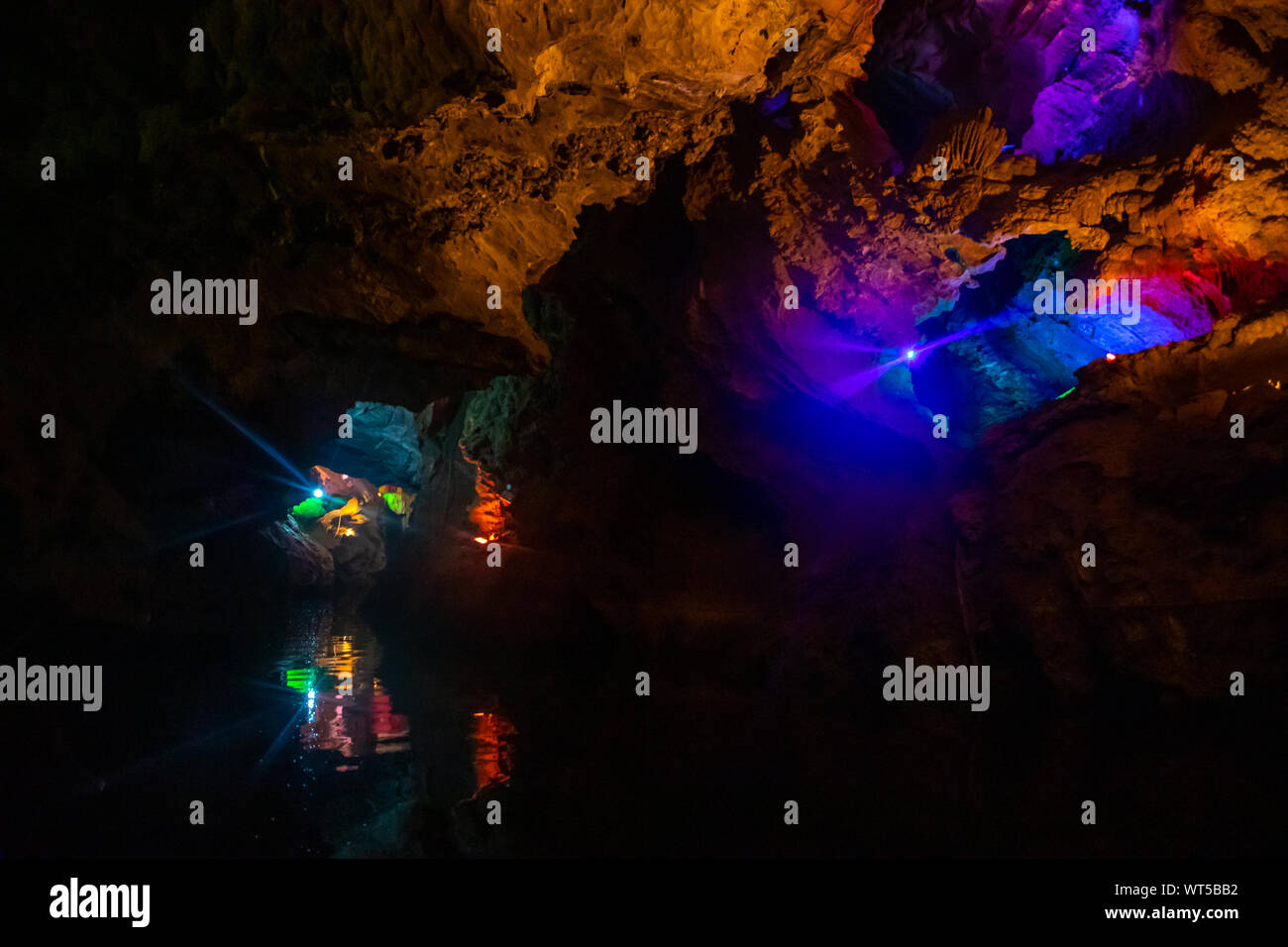 Beautiful illuminated multicolored stalactites in Danzhou Stone Flower ...