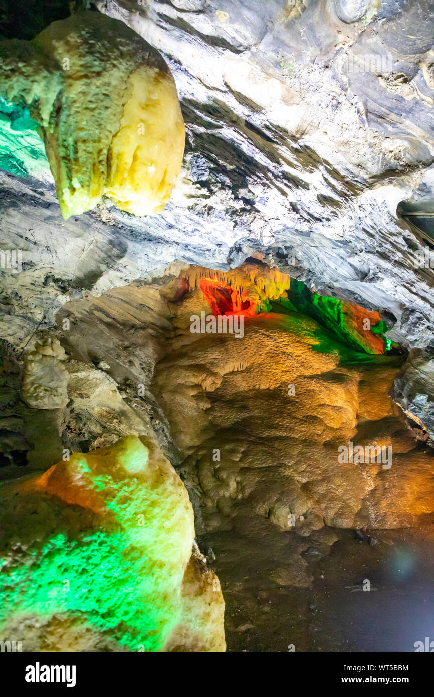 Beautiful illuminated multicolored stalactites in Danzhou Stone Flower ...