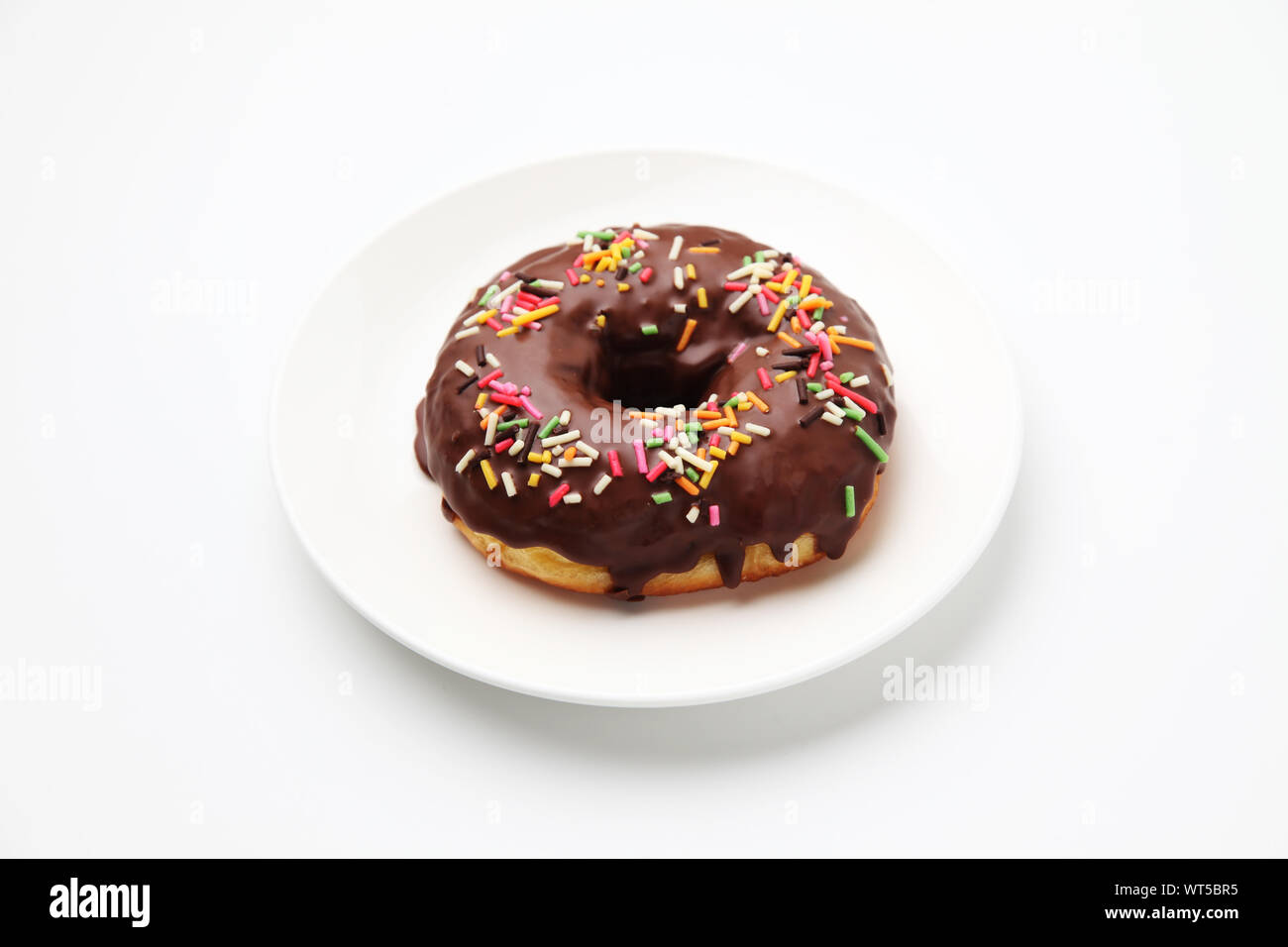 chocolate frosted doughnut on plate isolated on white background Stock ...
