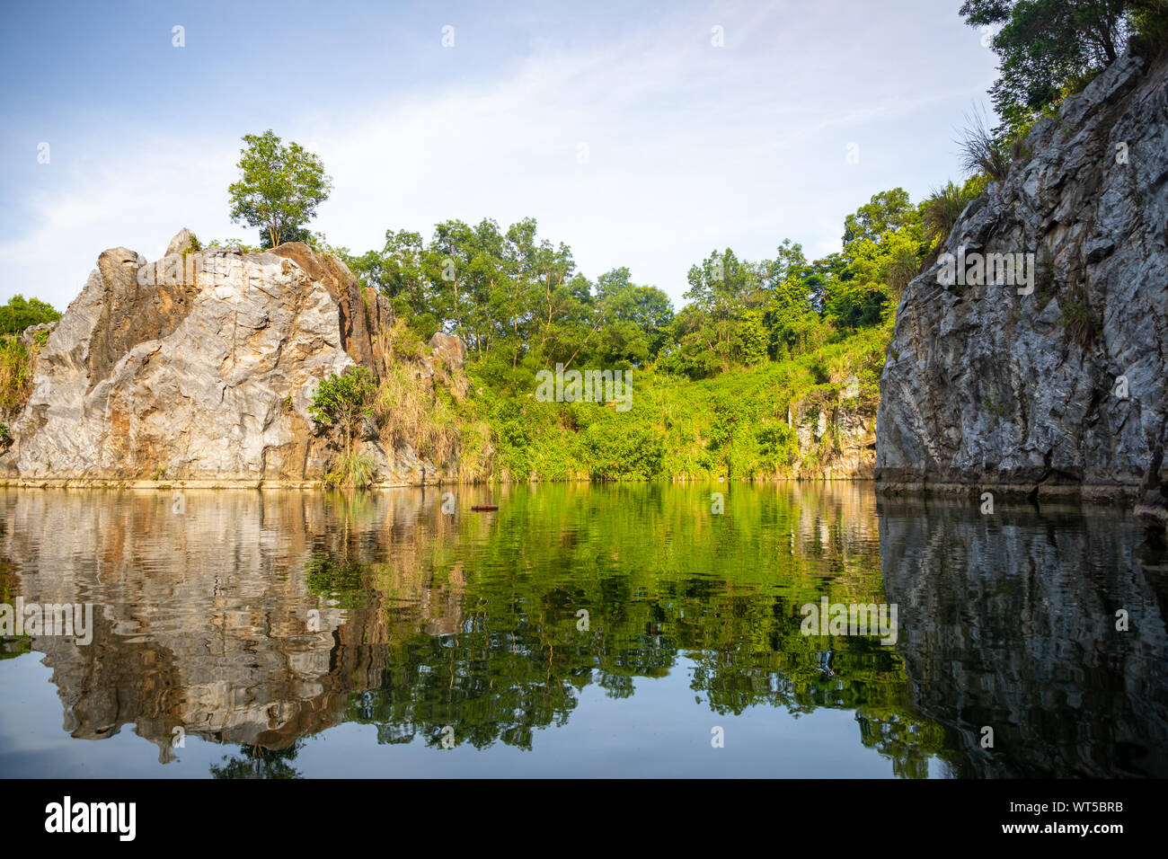 Lake and roks in Danzhou Stone Flower Caves, Geopark next to Haikou ...
