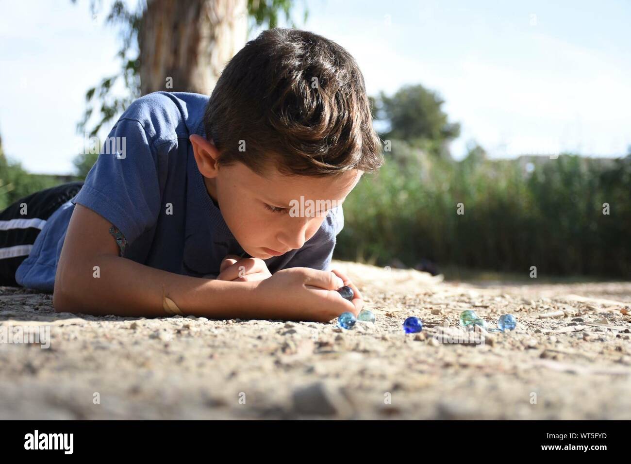 Boy Playing Marbles High Resolution Stock Photography and Images - Alamy