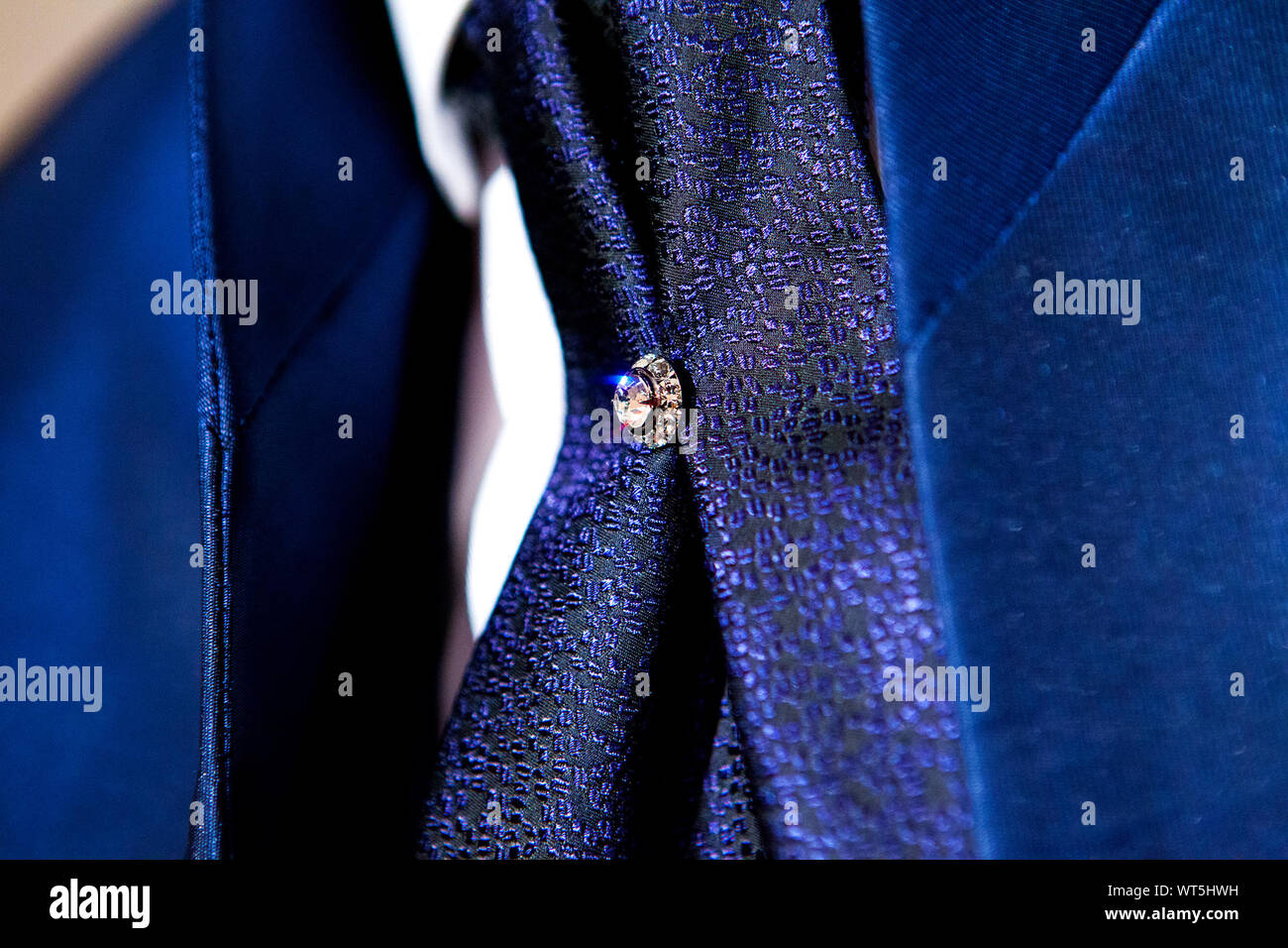 Gold suit hi-res stock photography and images - Alamy