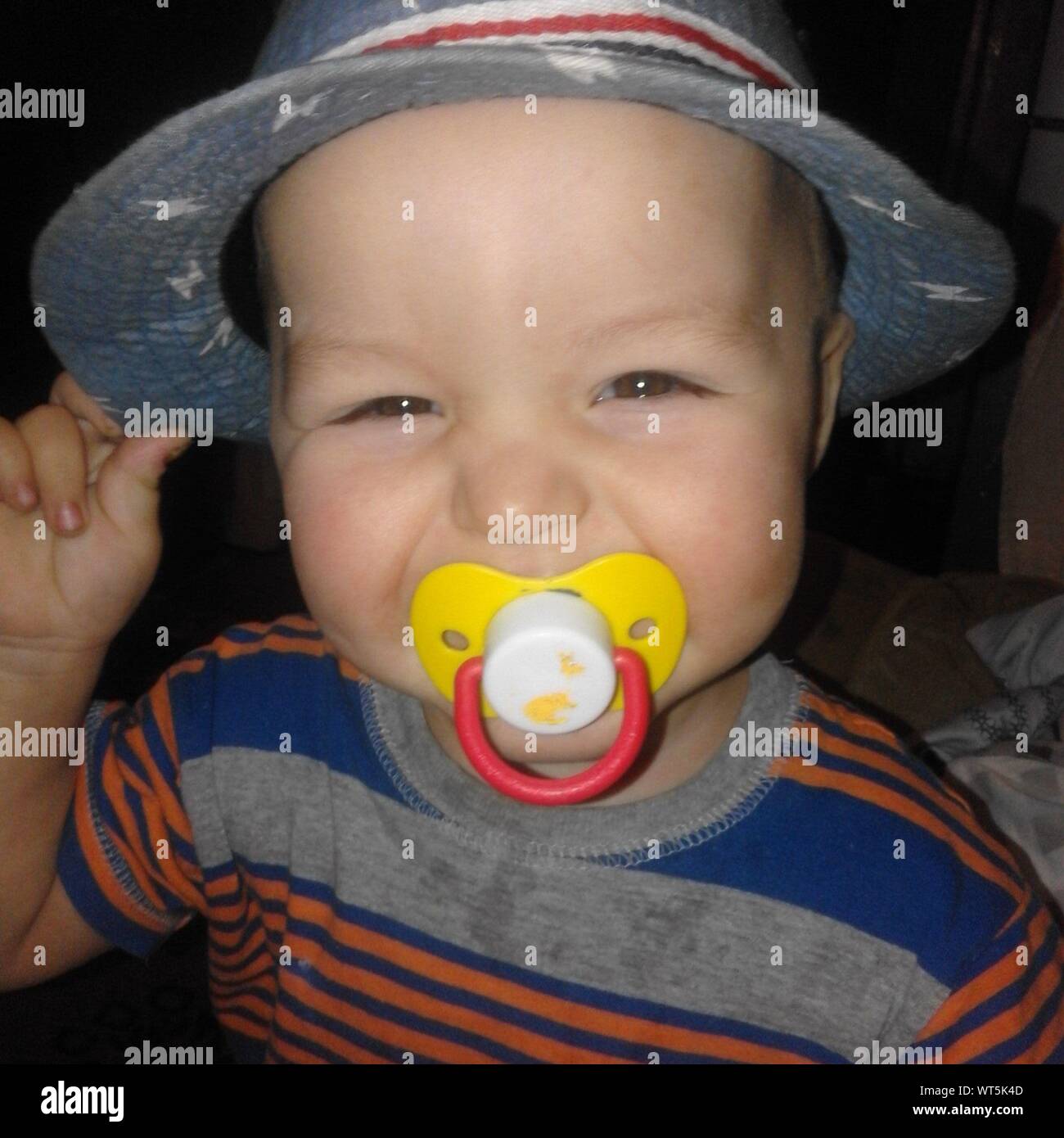 Cute baby pacifier looking camera hi-res stock photography and images ...