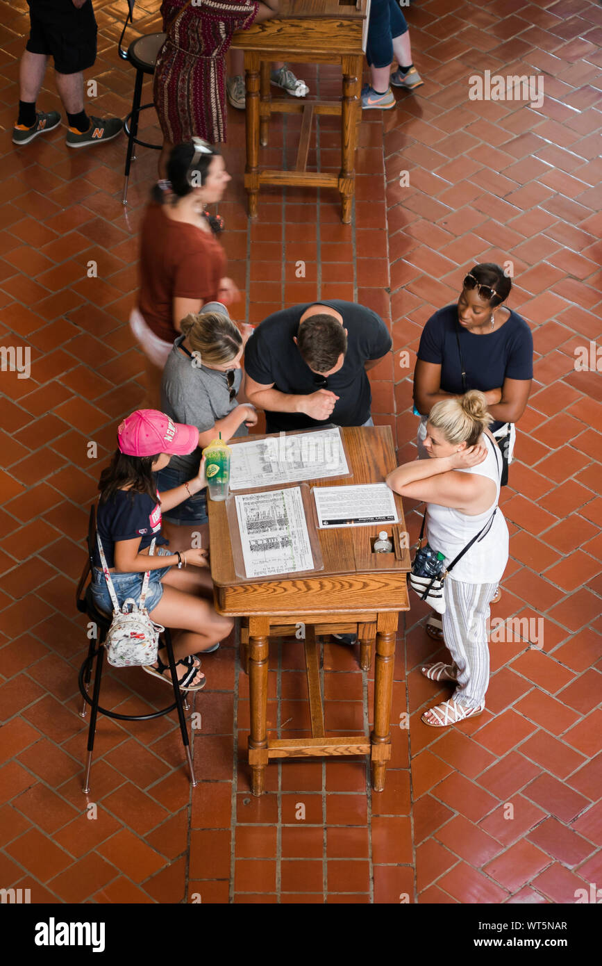 Registry Room Ellis Island, view of tourists standing around an ...