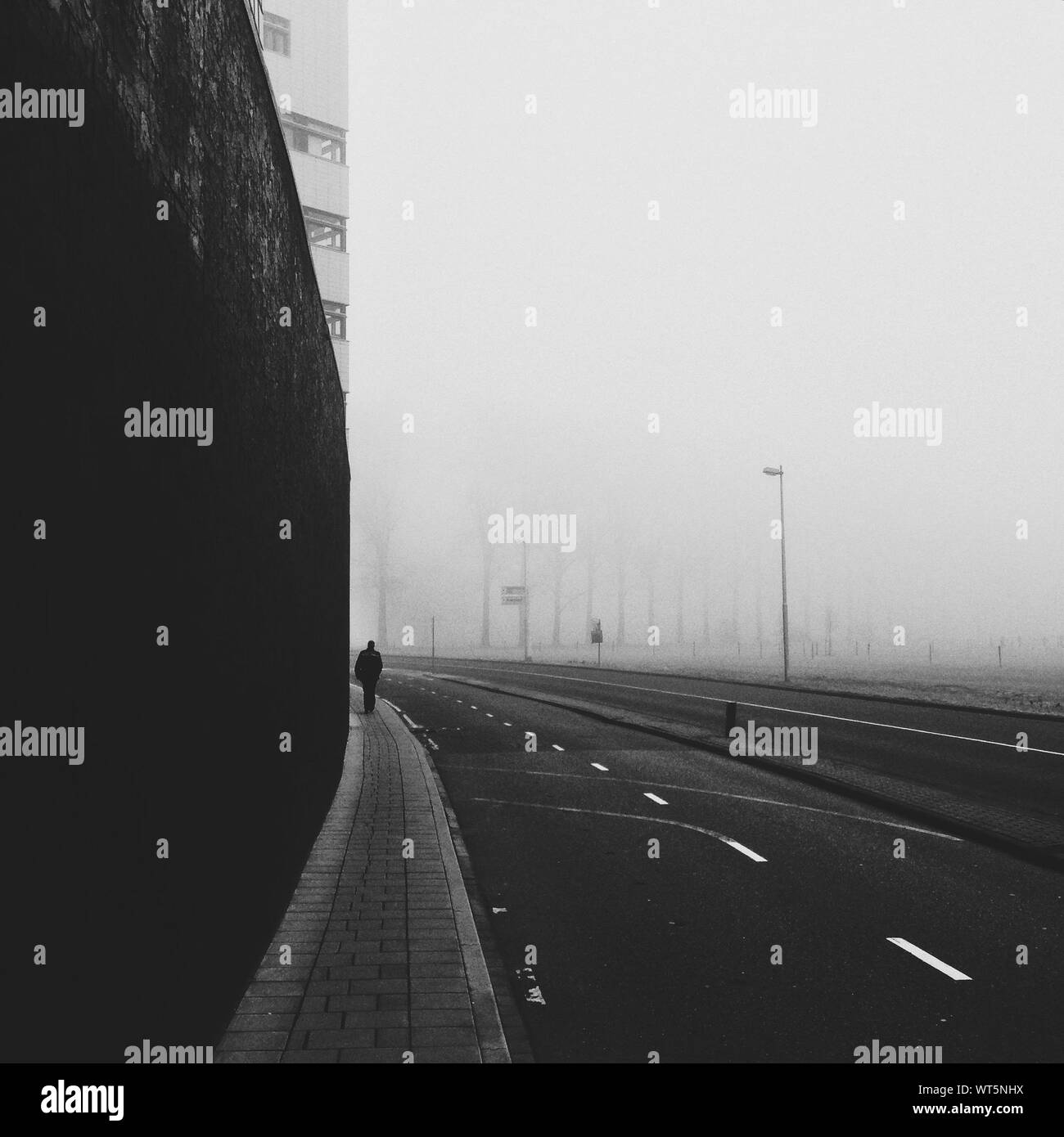Man Walking Along Motorway Stock Photo - Alamy