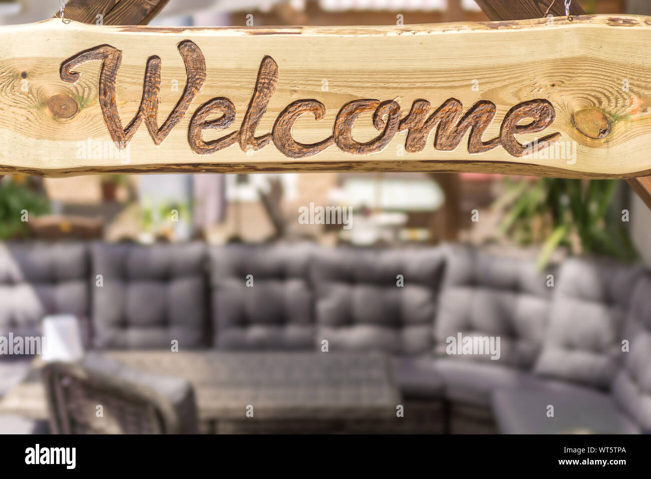 Relaxing lounge corner in modern design and welcome sign Stock Photo ...