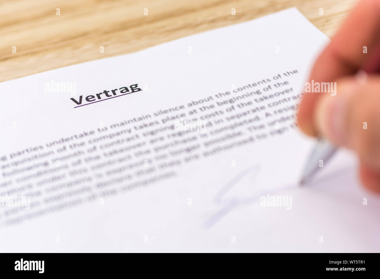 Signing of a contract with the German word for contract in the title ...