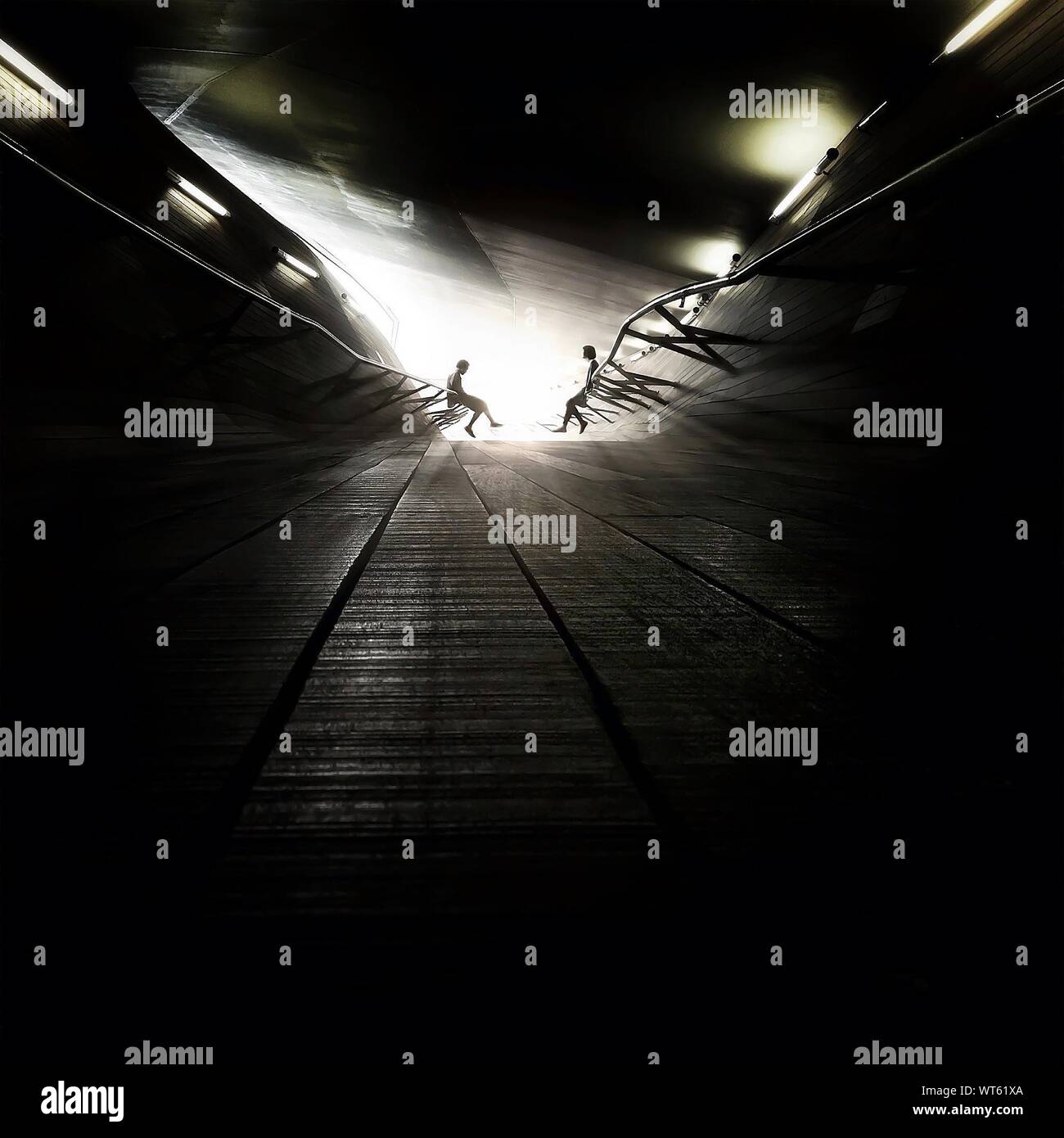 Sitting on railings hi-res stock photography and images - Alamy