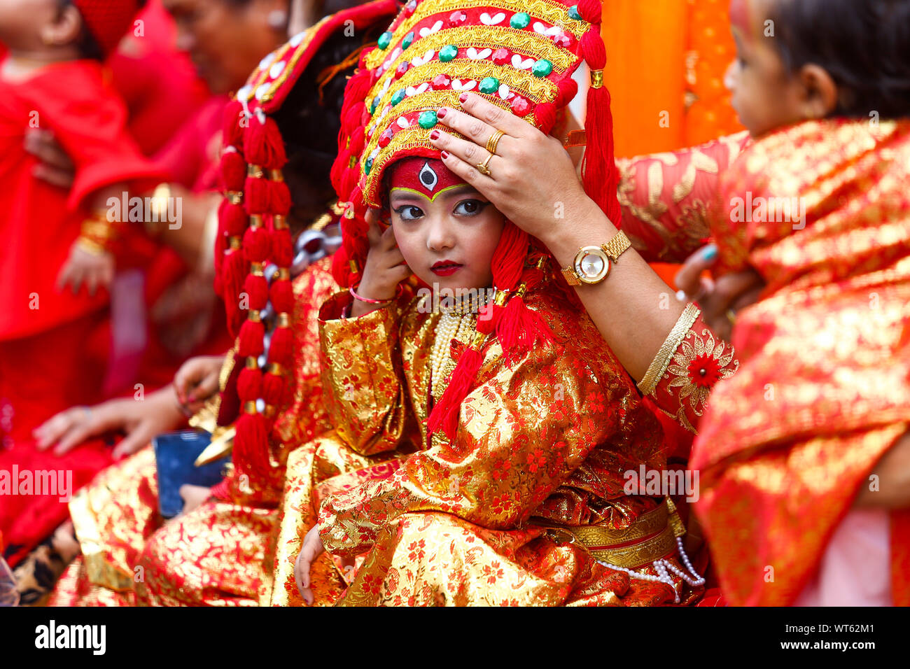Kathmandu, Nepal. 11th Sep, 2019. A young girl being dressed as the ...