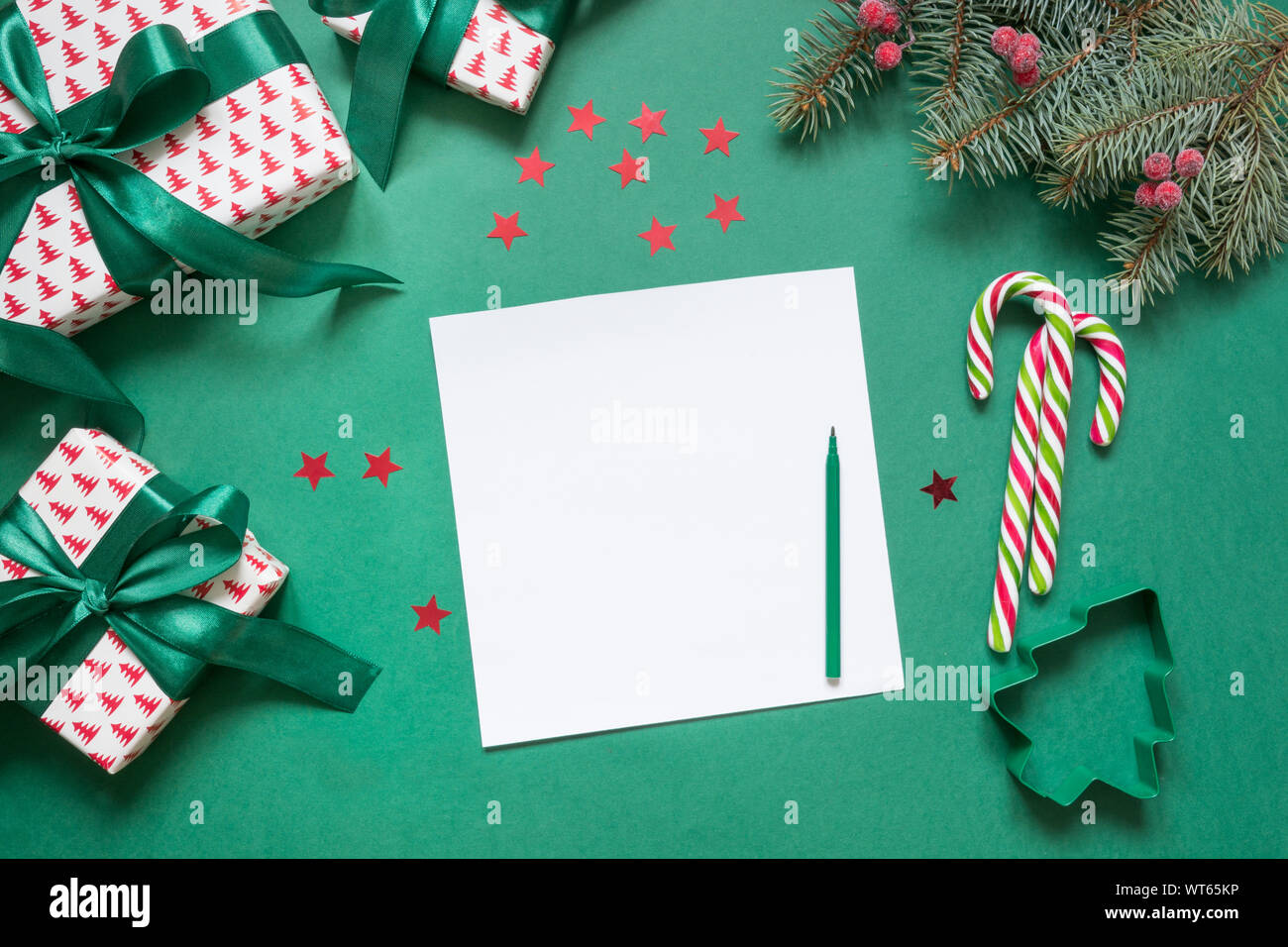 Christmas empty blank letter to Santa or invitation on green. Top view ...