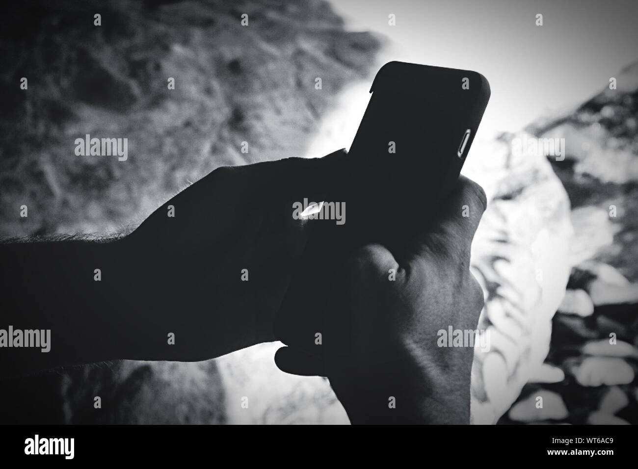 Person holding phone home silhouette hi-res stock photography and ...