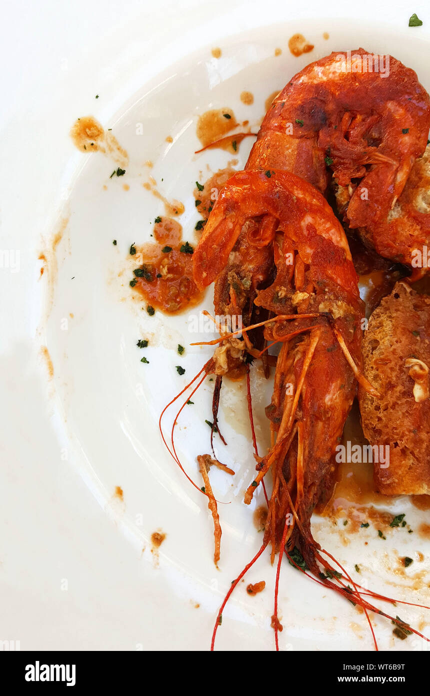 Concept of italian food. Prawns in tomato sauce with toasted bread ...