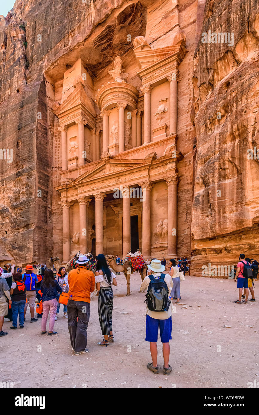 Tourists jostling for photo opportunities in front of the treasury ...