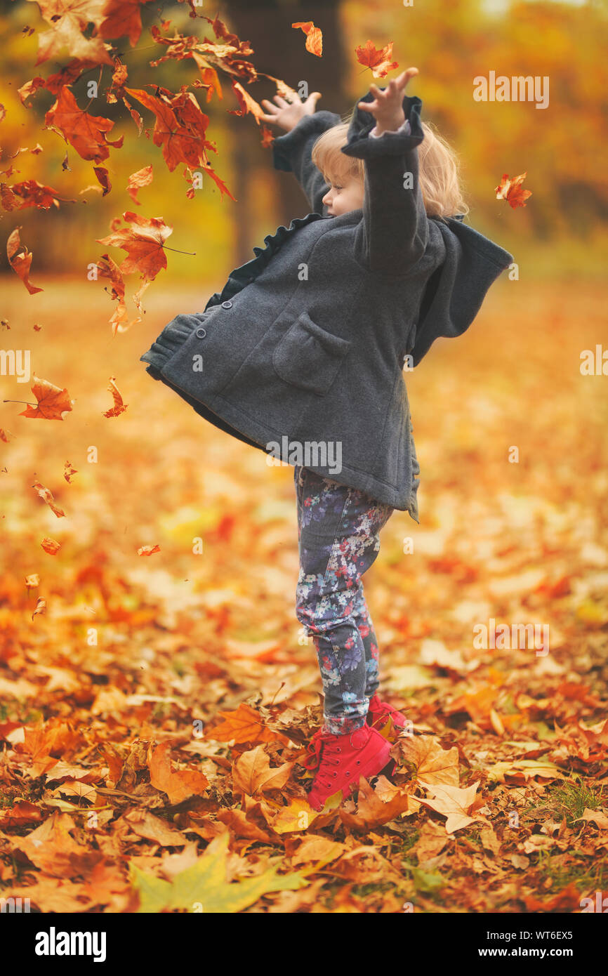 Girl In Falling Leaves Photography