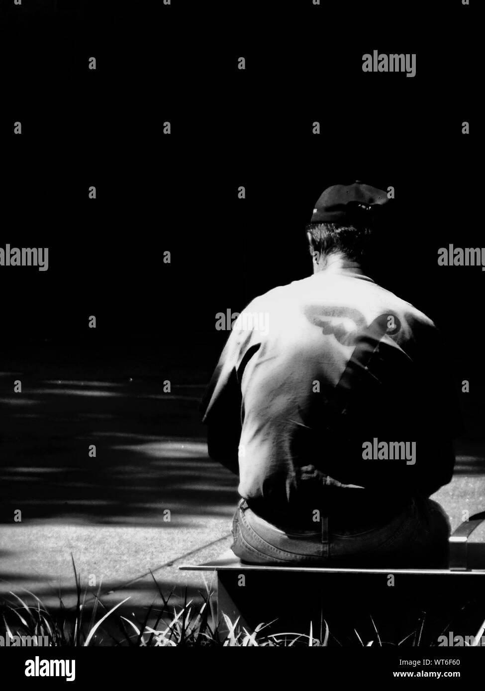 Man sitting outdoors rear view Black and White Stock Photos & Images ...