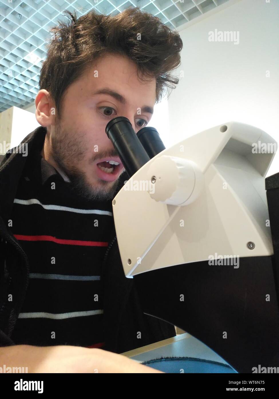 Man Looking Through Microscope High Resolution Stock Photography and ...