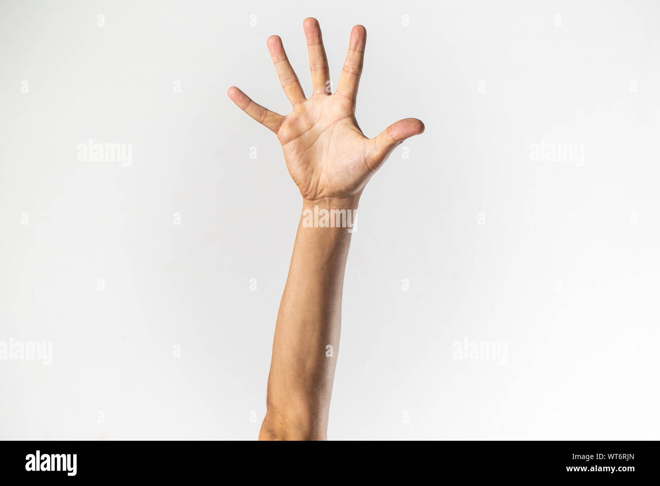 hand rising in a white background Stock Photo - Alamy