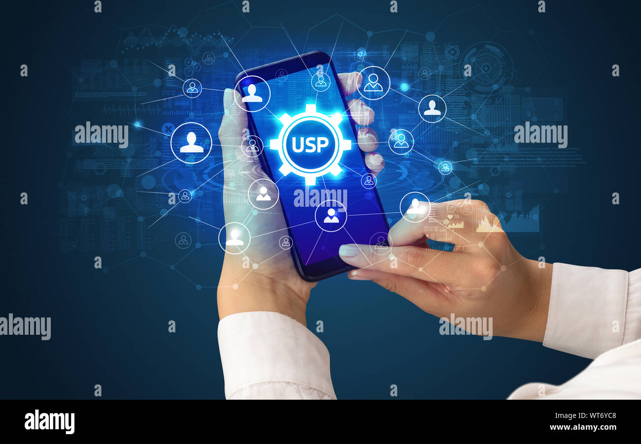 Female hand holding smartphone with USP abbreviation, modern technology ...