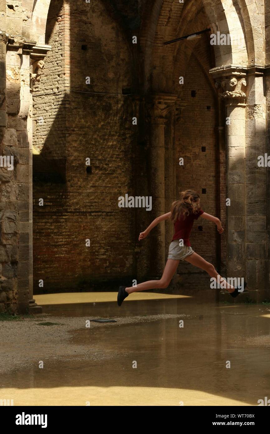 Jumping over puddle hi-res stock photography and images - Alamy