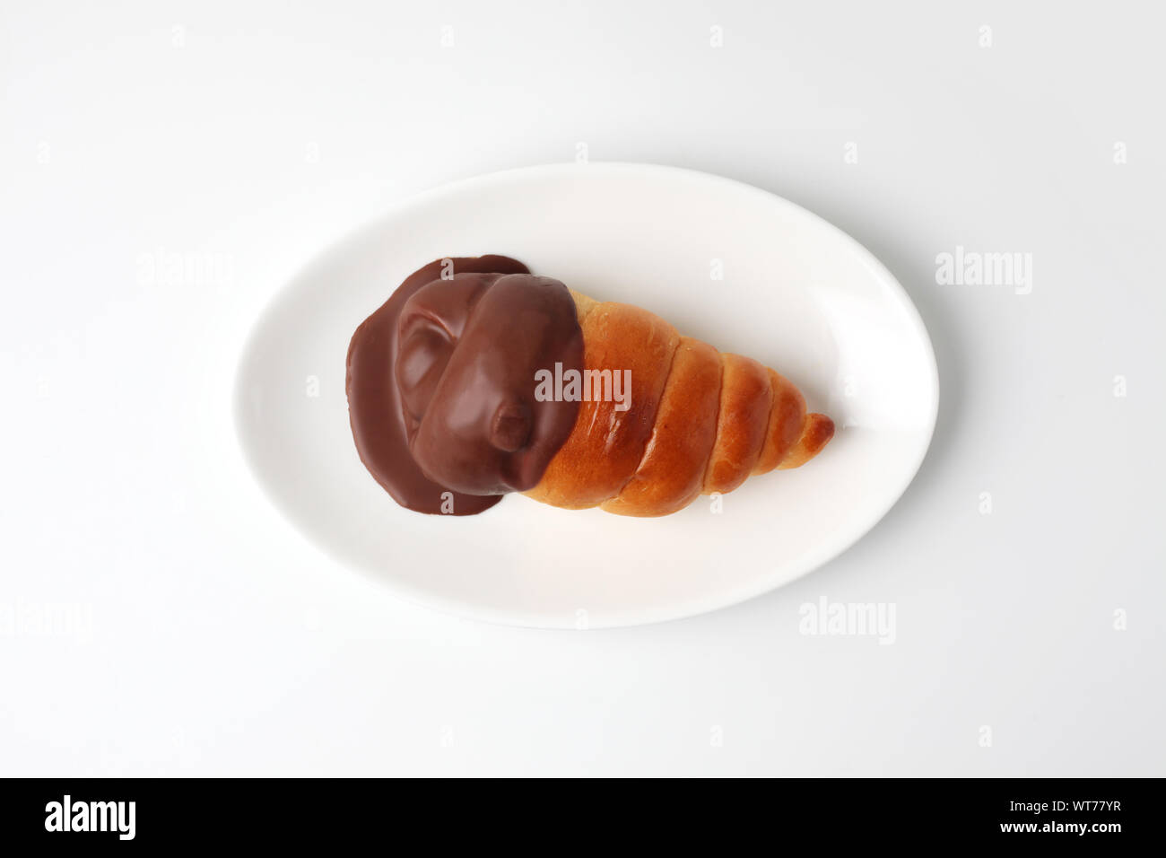 chocolate cornet roll bread on plate closeup isolated on white ...