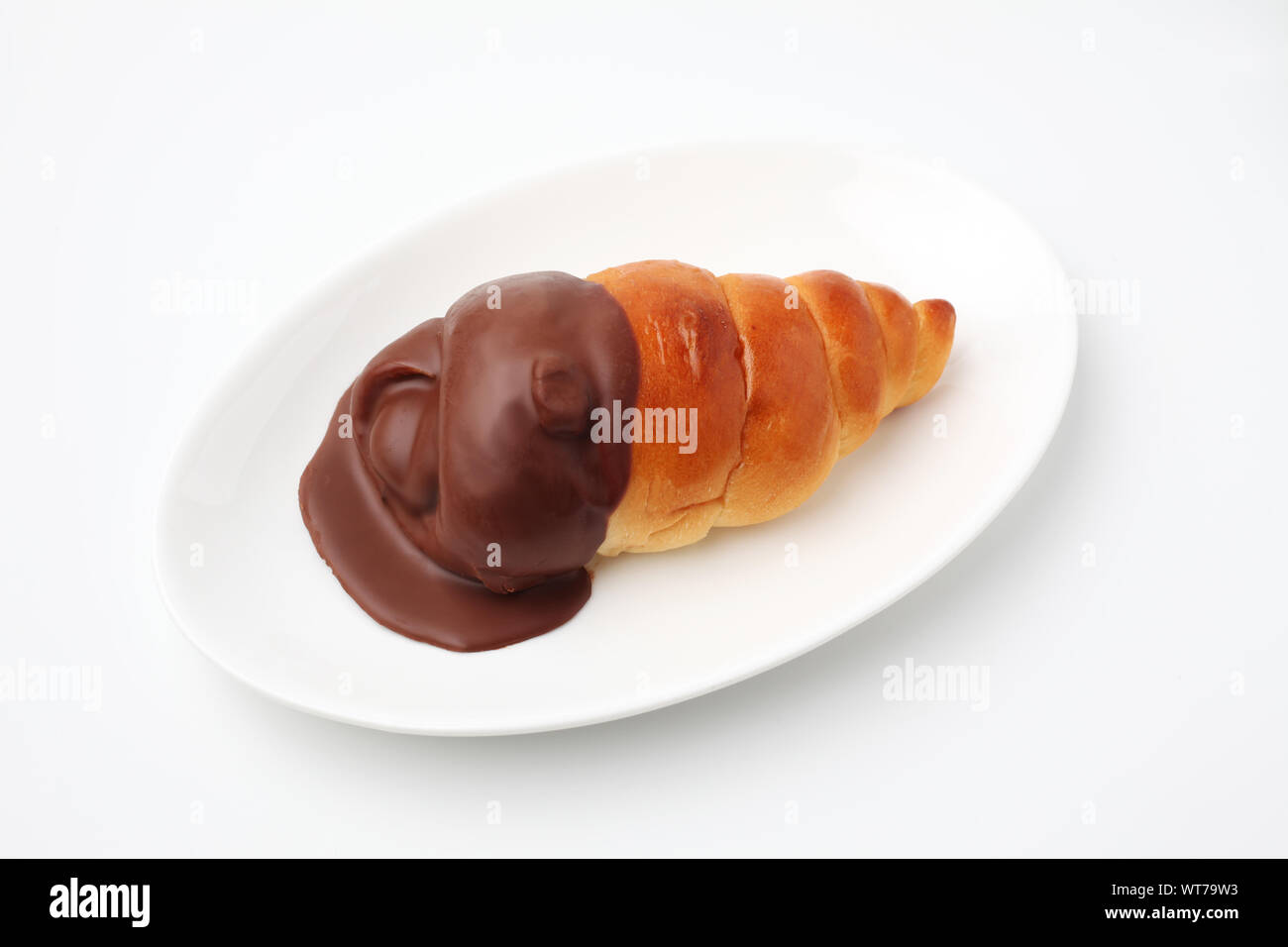 chocolate cornet roll bread on plate closeup isolated on white ...