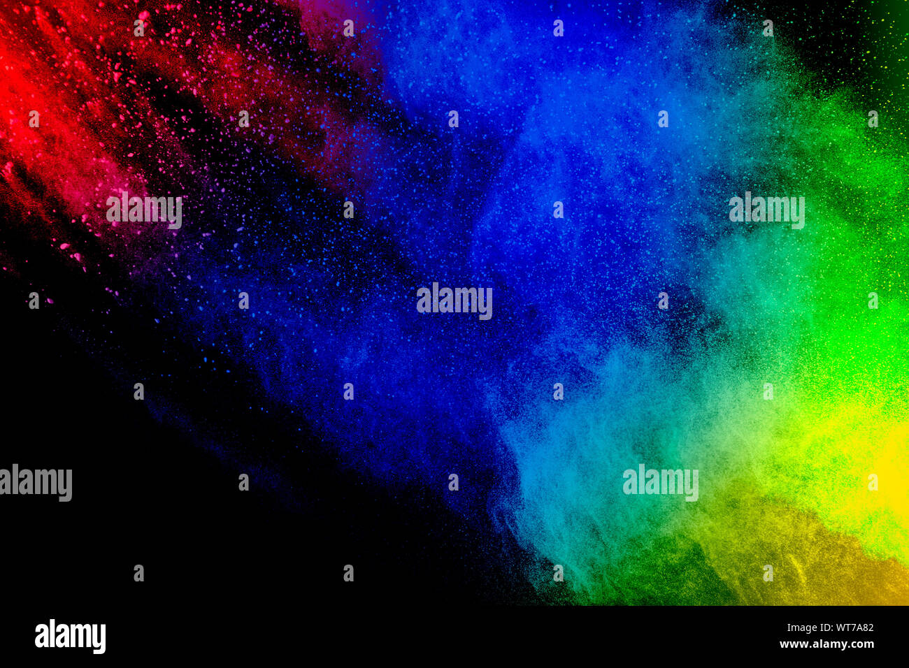 Freeze motion of colorful dust particles on black background.Abstract ...