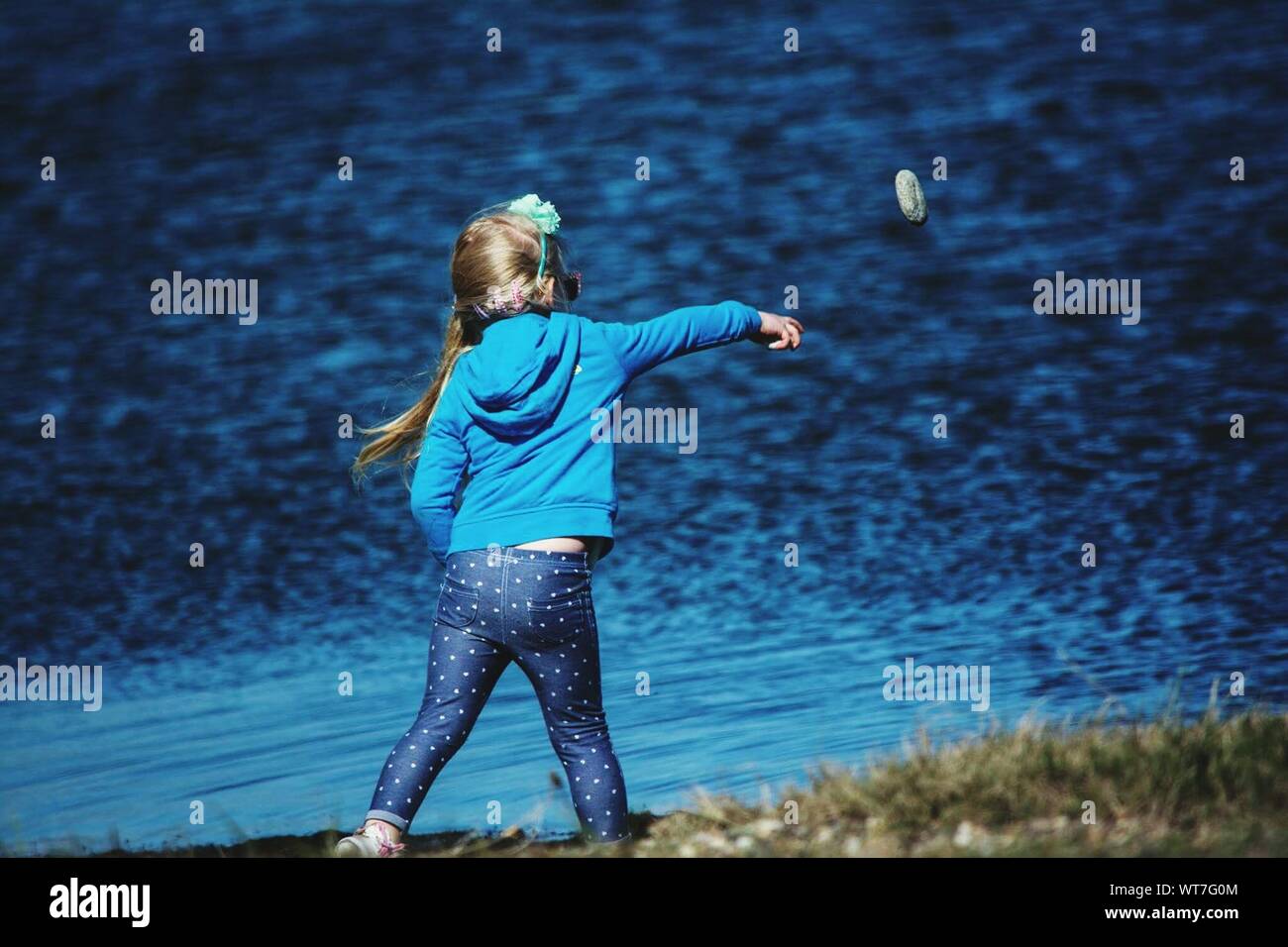 Throwing pebble to water hi-res stock photography and images - Alamy