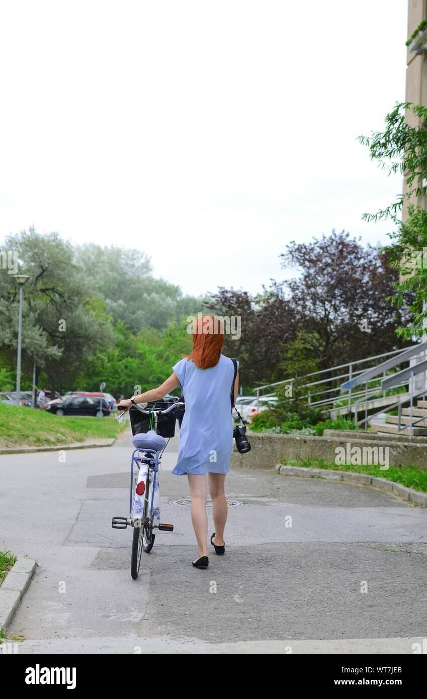 Young woman riding road bike hi-res stock photography and images - Alamy