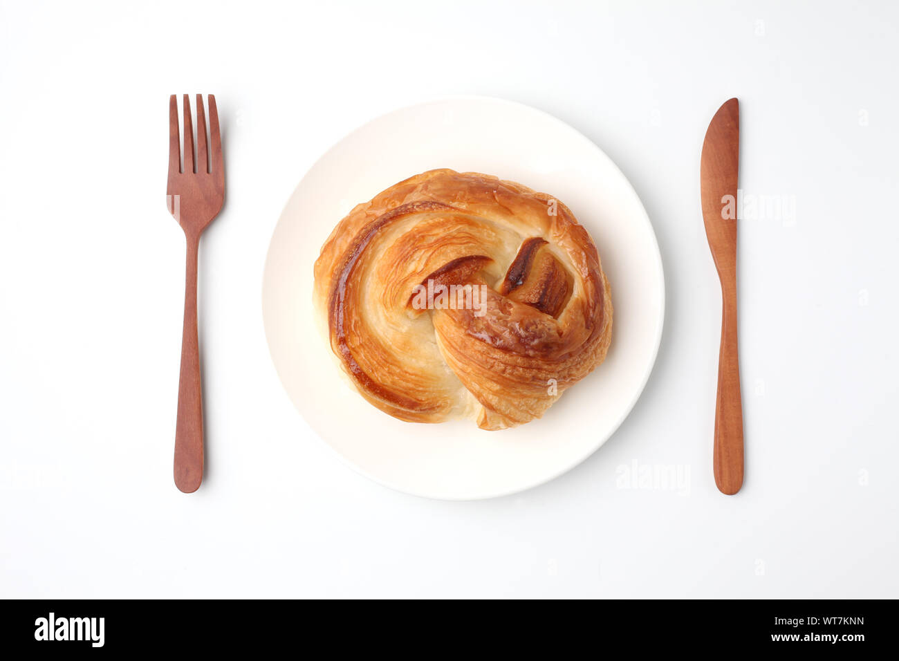 round danish bread on plate closeup isolated on white background Stock ...