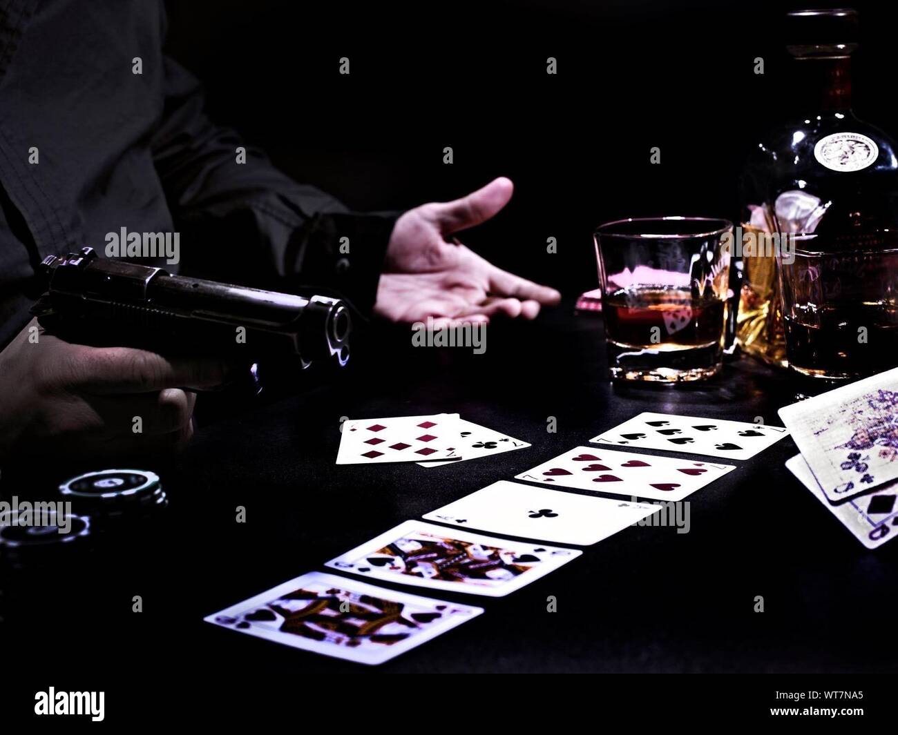 Gun playing cards hi-res stock photography and images - Alamy